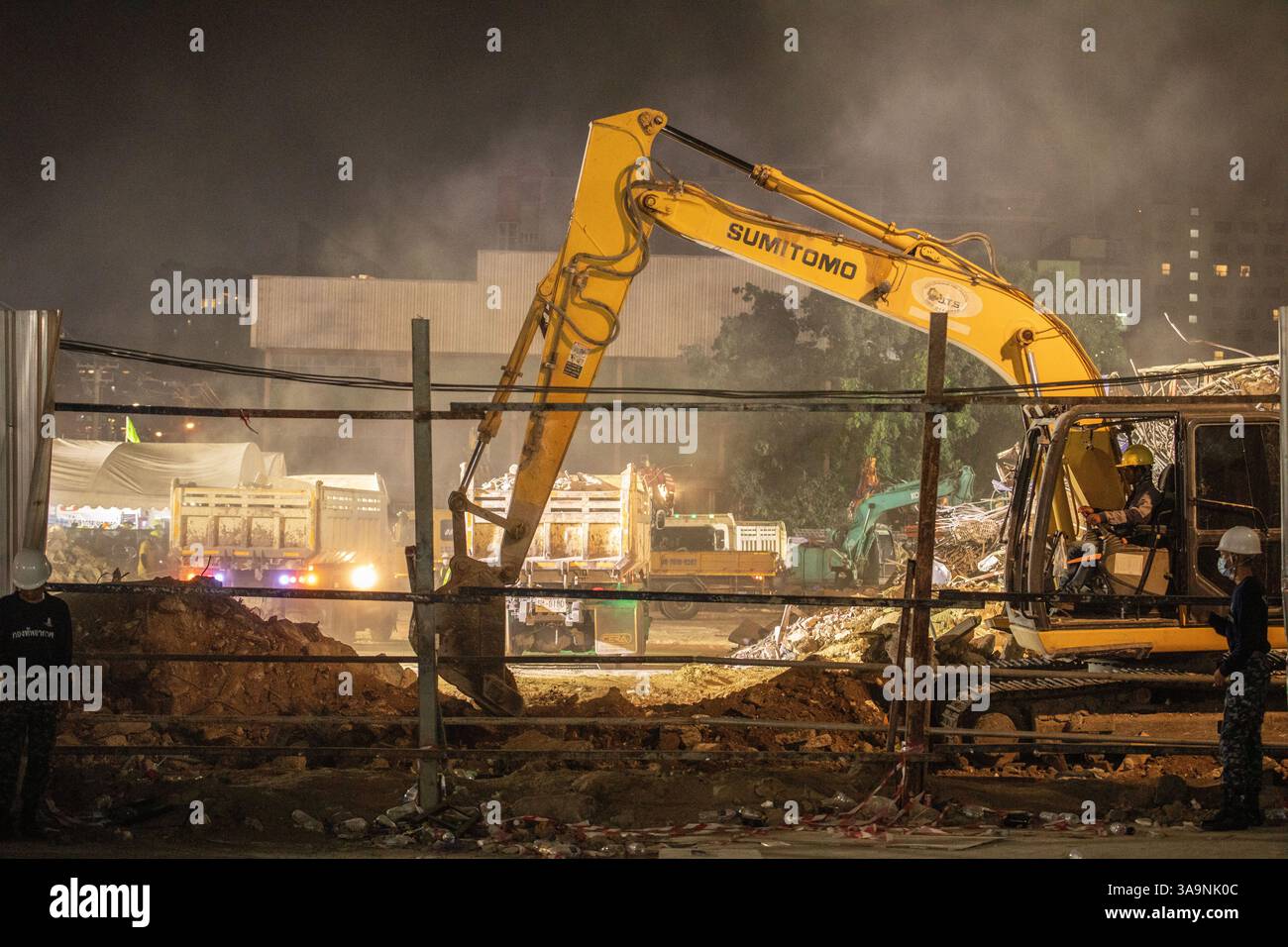 Rescue teams work tirelessly amidst the rubble of a collapsed ...