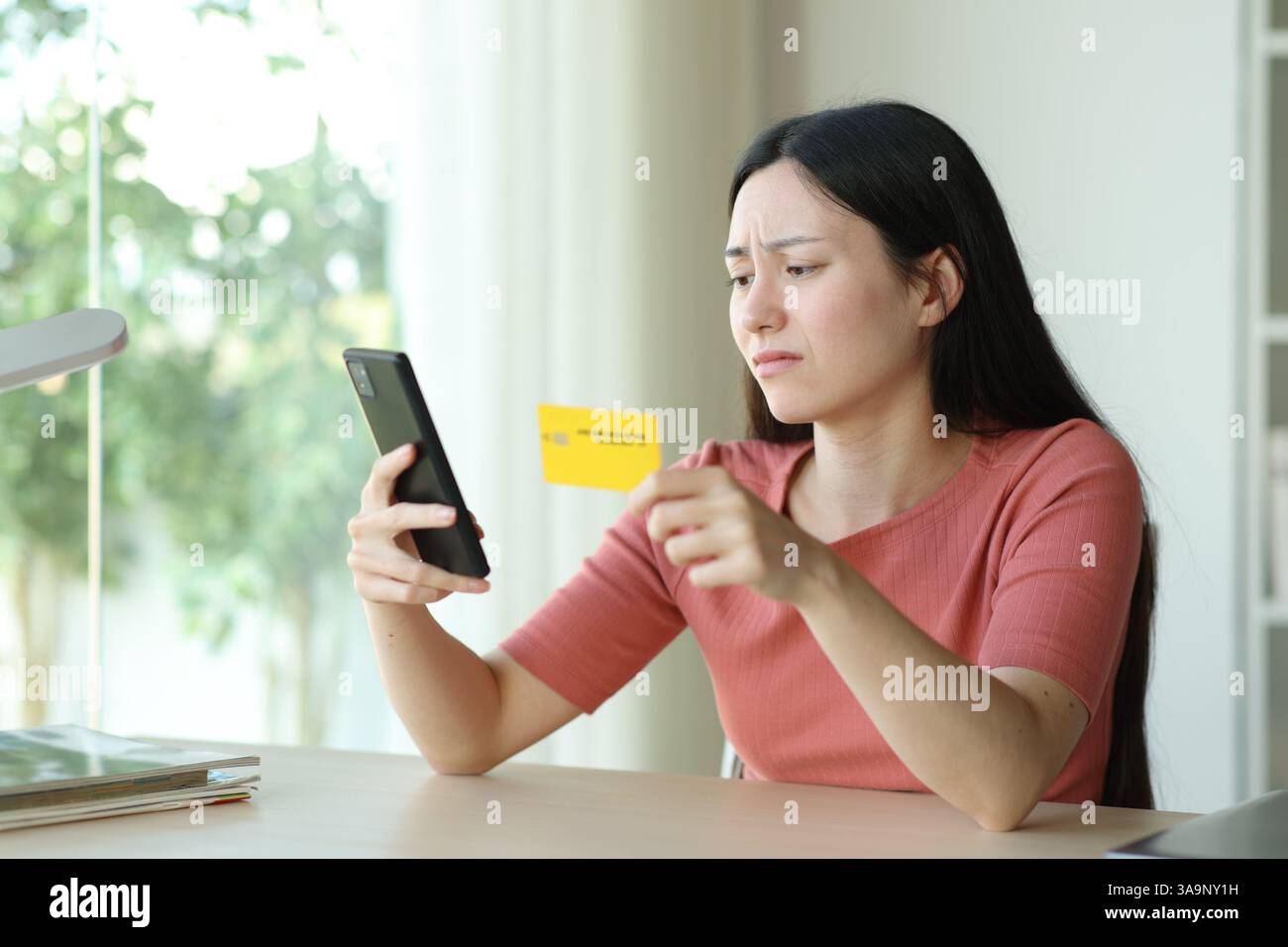 Sad asian woman buying hi-res stock photography and images - Alamy