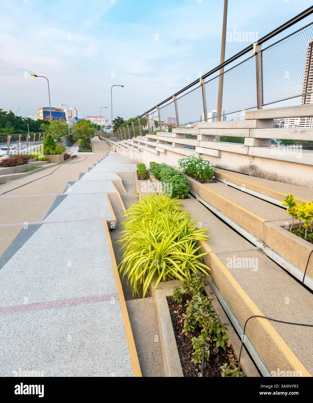 Environmentally friendly,elevated walkway with many plants,flowers and ...