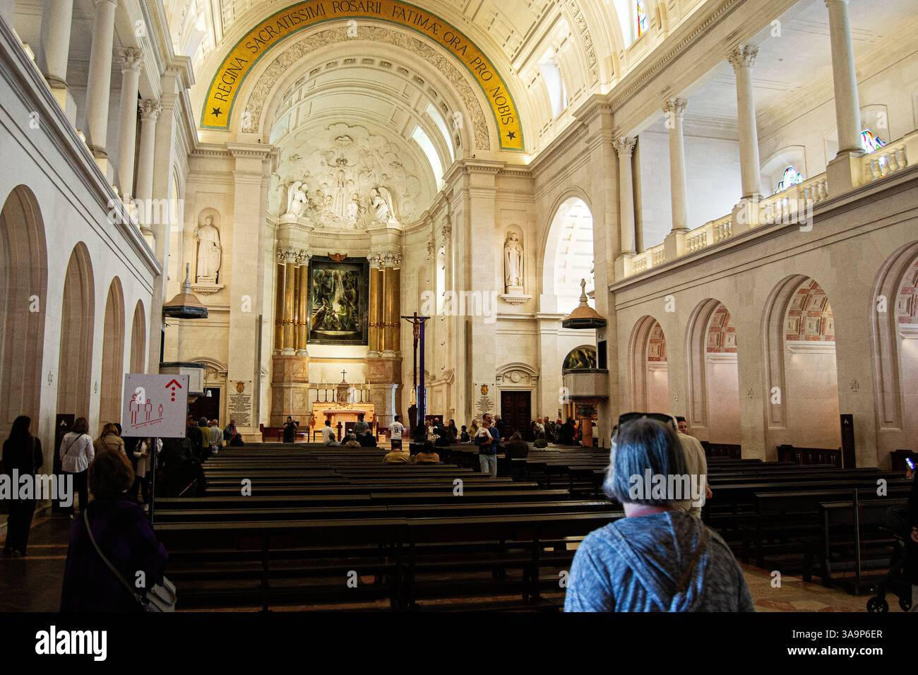 Fatima, Portugal - March 26, 2025: Visitors inside a historic religious ...