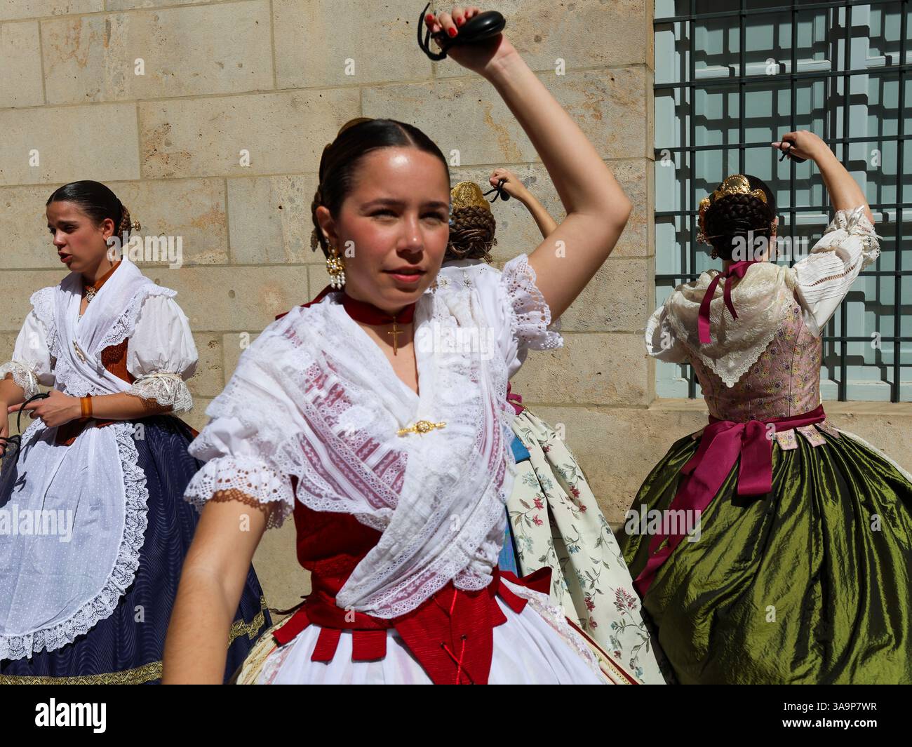 Women dressed in the traditional Fallera attire, also known as the ...