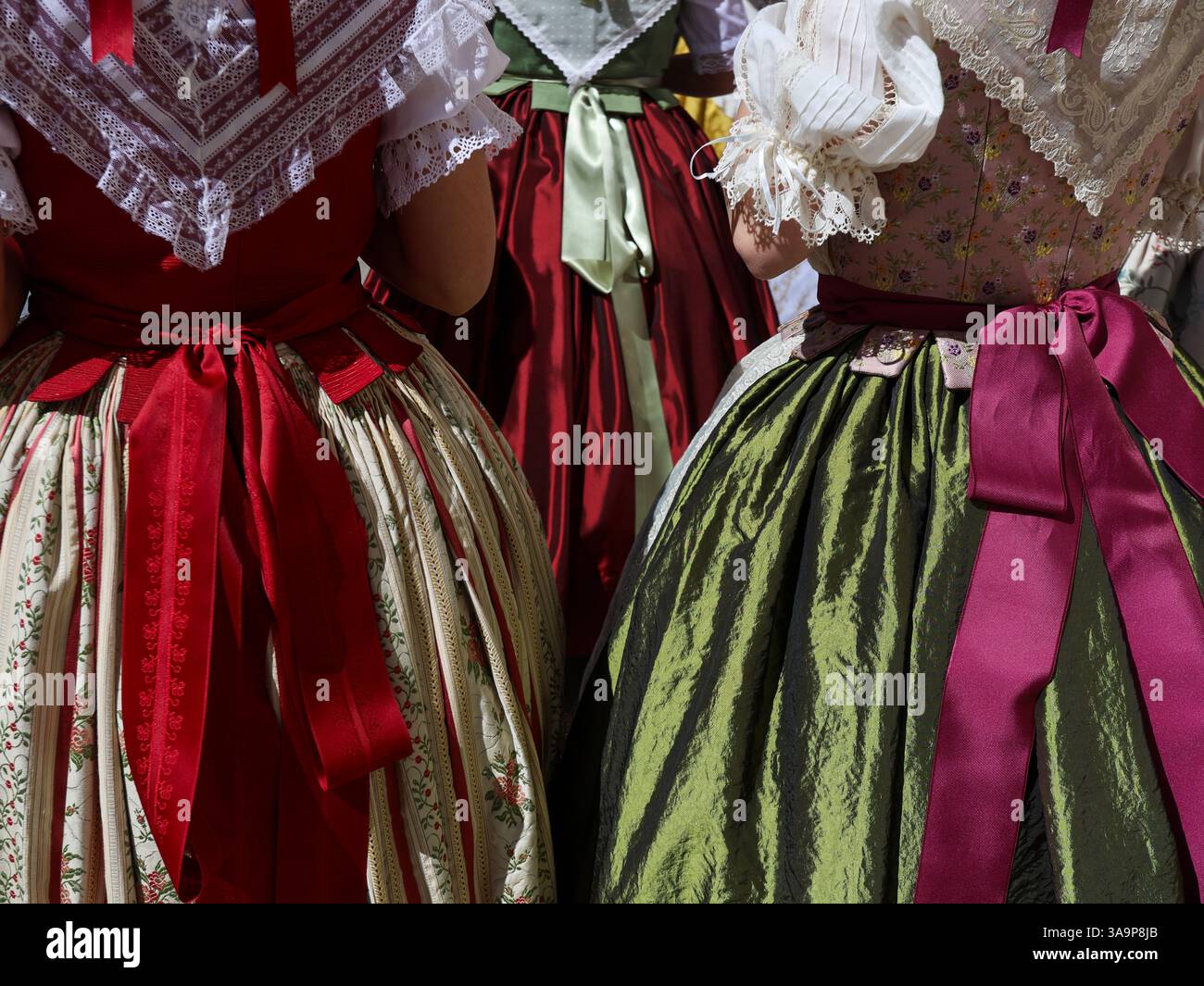 Women dressed in the traditional Fallera attire, also known as the ...