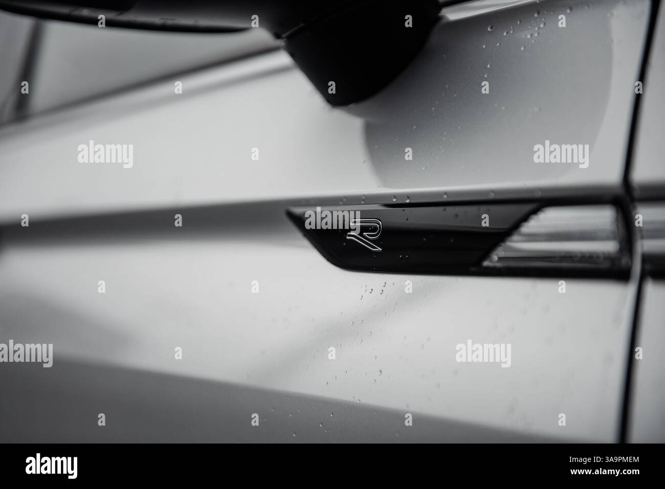 R-line badge on the exterior of Volkswagen Tiguan. Close up view of a ...