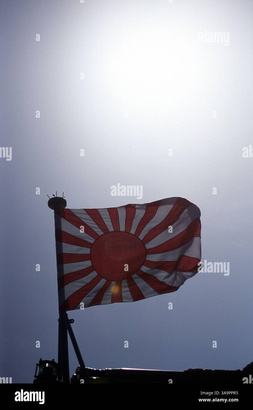 Apr 22, 2000; Tokyo, Japan; The sun shines through a Japanese flag ...