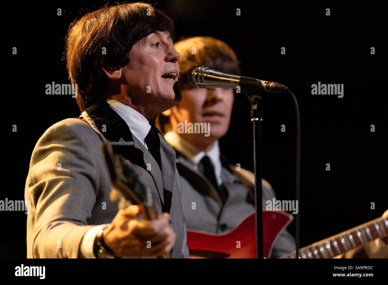 Cambridge, UK, 30 March, 2025. Bootleg Beatles in concert. Pictured left to right, Steve White ...