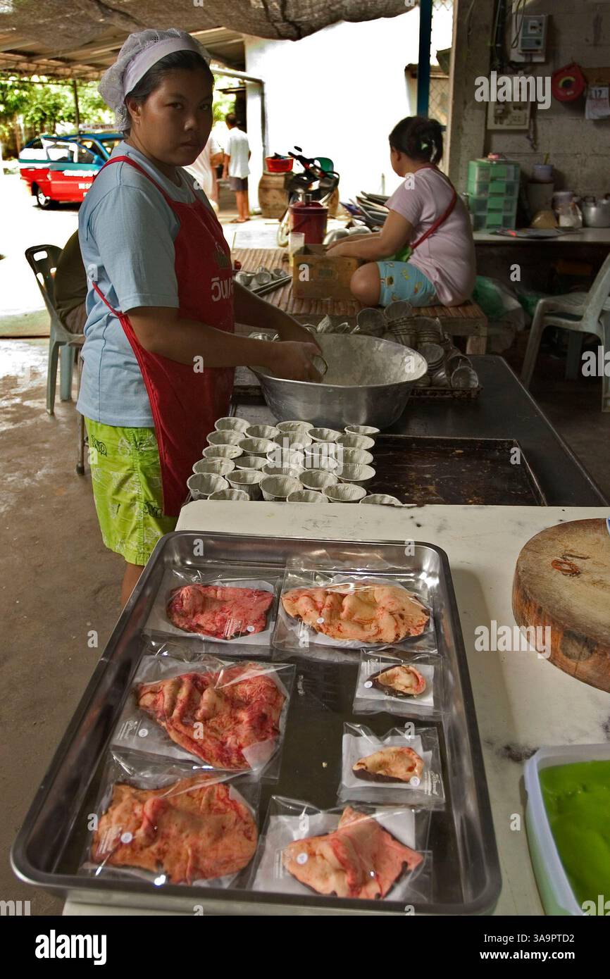 Sep 17, 2005; Potharam, THAILAND; Staff of the Unarrom family bakery ...