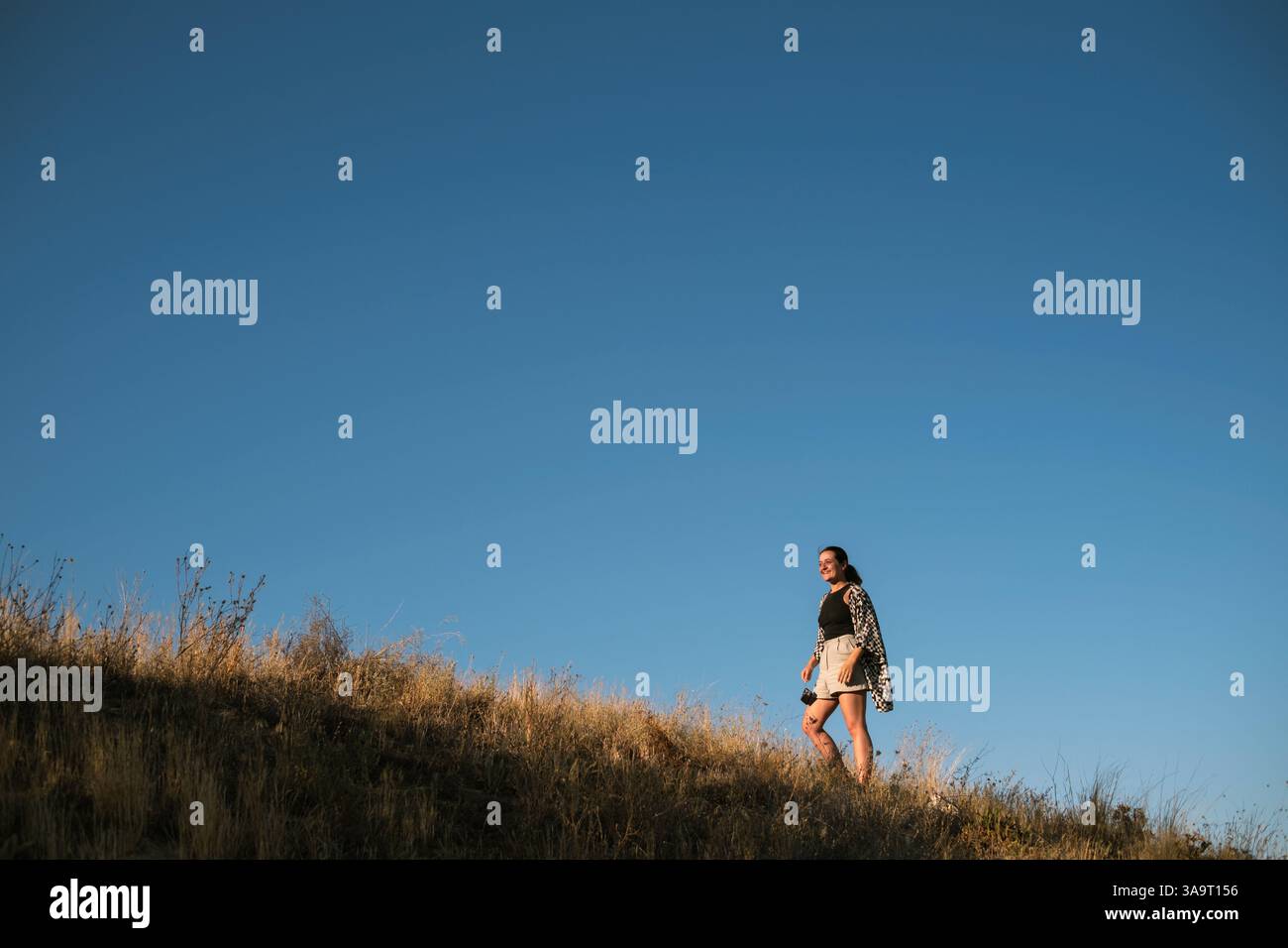 Female Traveler Smiling and Staring to the Sun in Cappadocia Stock ...