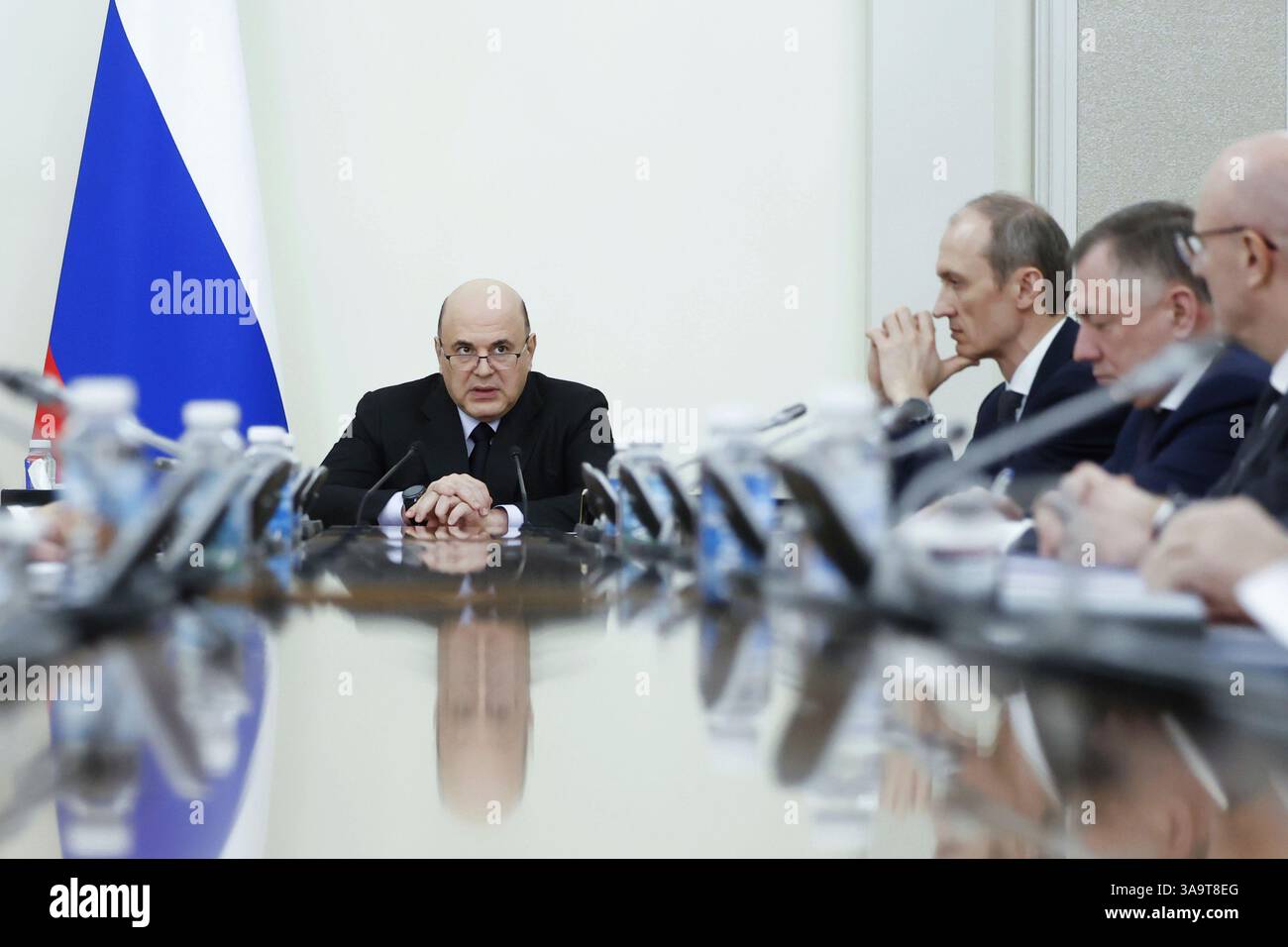 Russian Prime Minister Mikhail Mishustin leads a meeting with his ...