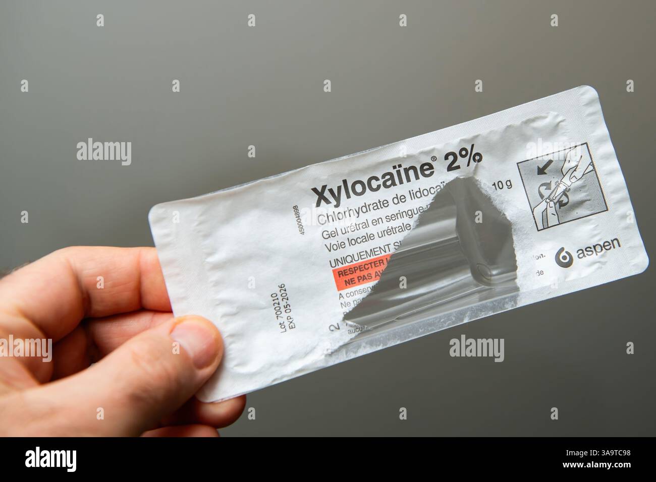 Paris, France - Mar 10, 2025: A person holds a blister package of Xylocaine 2 percent urethral ...