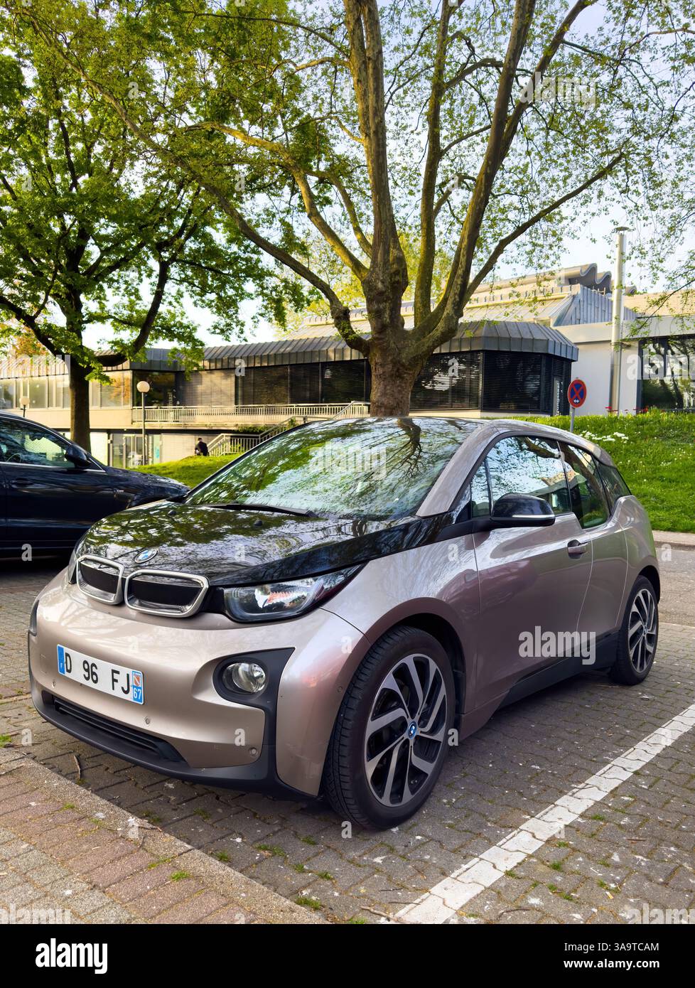 Paris, France - Apr 14, 2024: Electric BMW i3 parked under a large ...