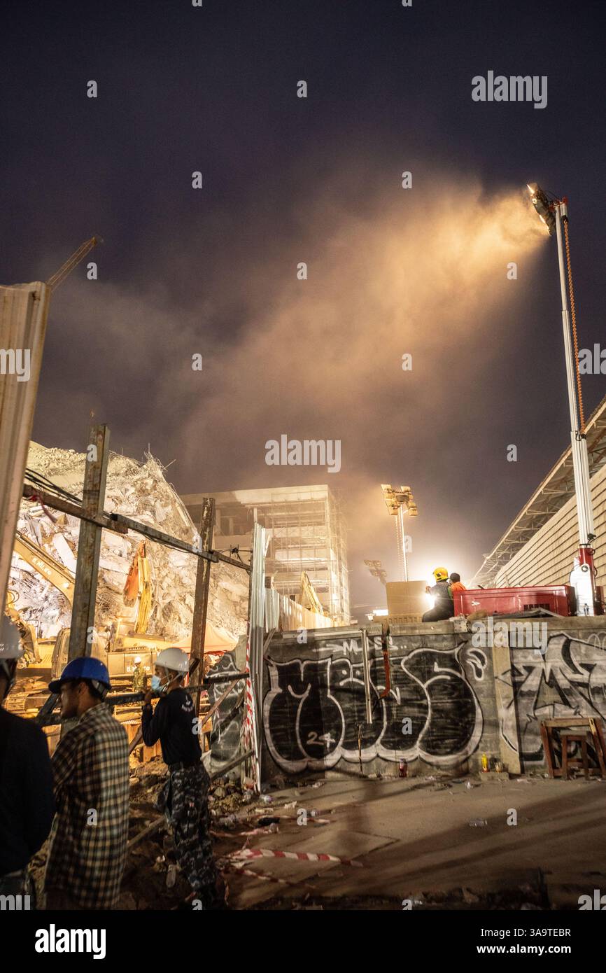 Rescue teams work tirelessly amidst the rubble of a collapsed ...