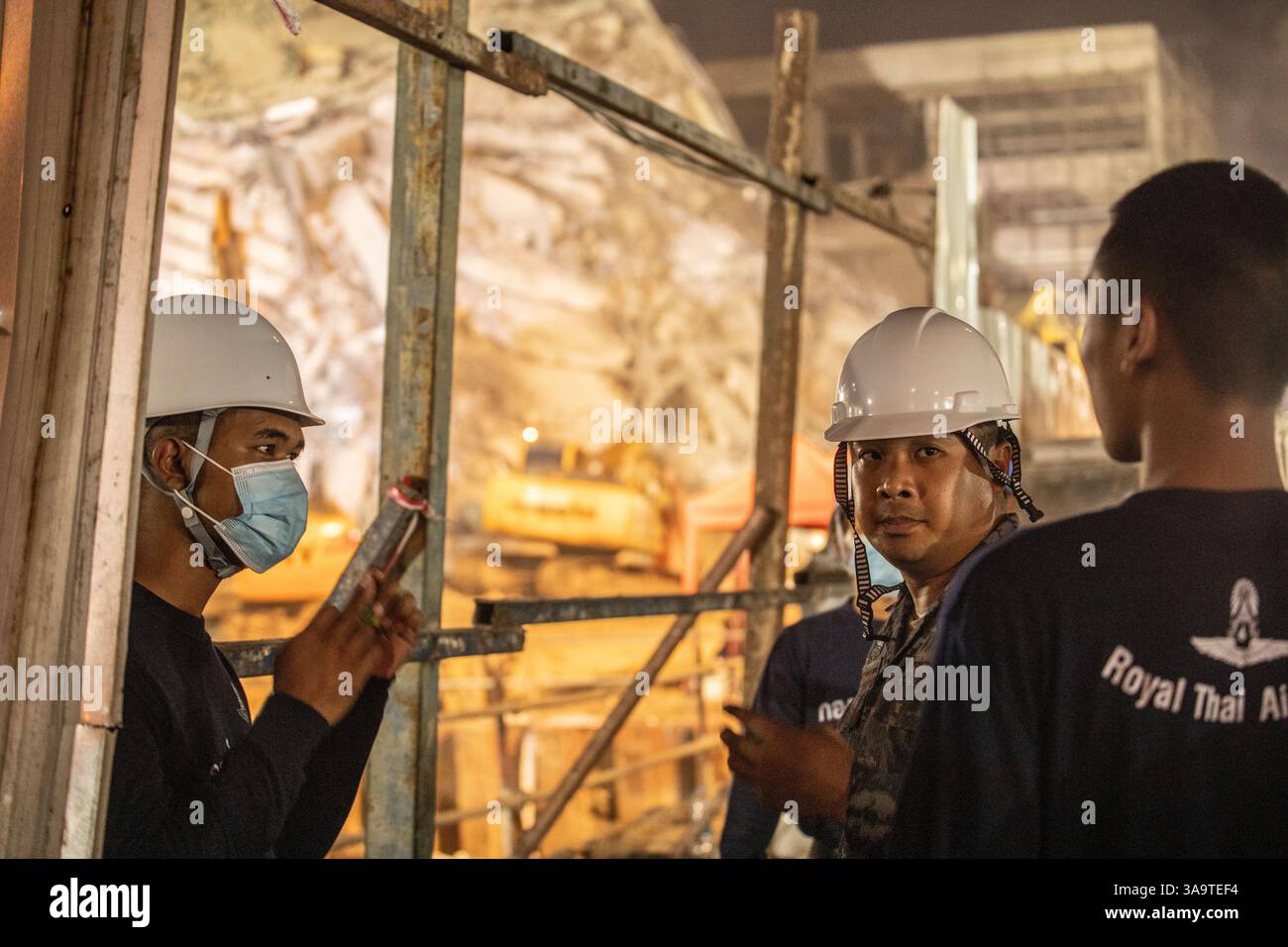 Rescue teams work tirelessly amidst the rubble of a collapsed ...