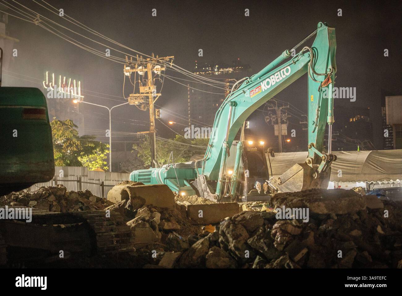 Rescue teams work tirelessly amidst the rubble of a collapsed ...