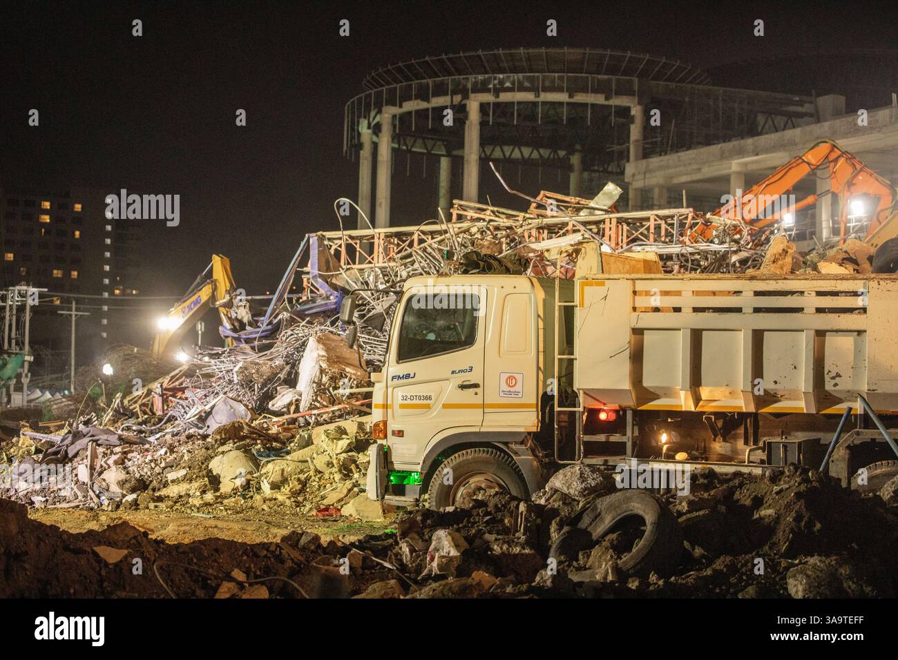 Rescue teams work tirelessly amidst the rubble of a collapsed ...