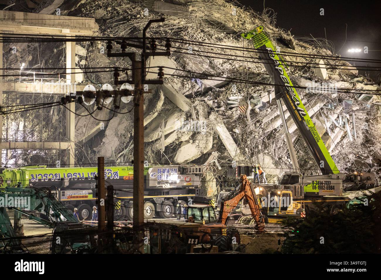 Rescue teams work tirelessly amidst the rubble of a collapsed ...