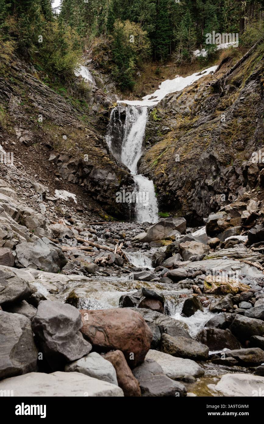 Mountain Waterfall Cascading Over Jagged Rocks in a Remote Wilderness ...