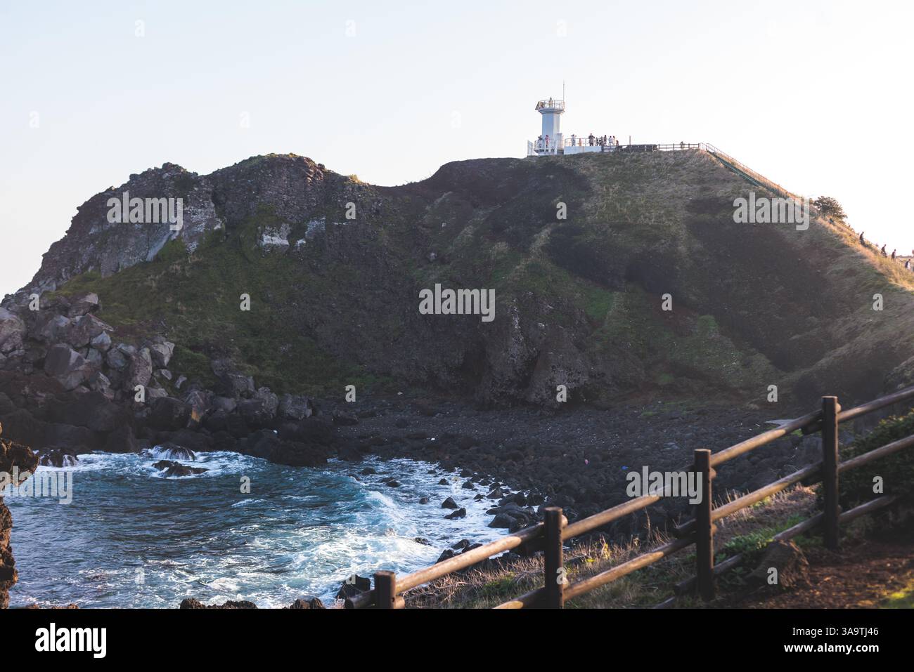 Jeju-do, Seopjikoji cape landscape with lighthouse and sea, east coast ...