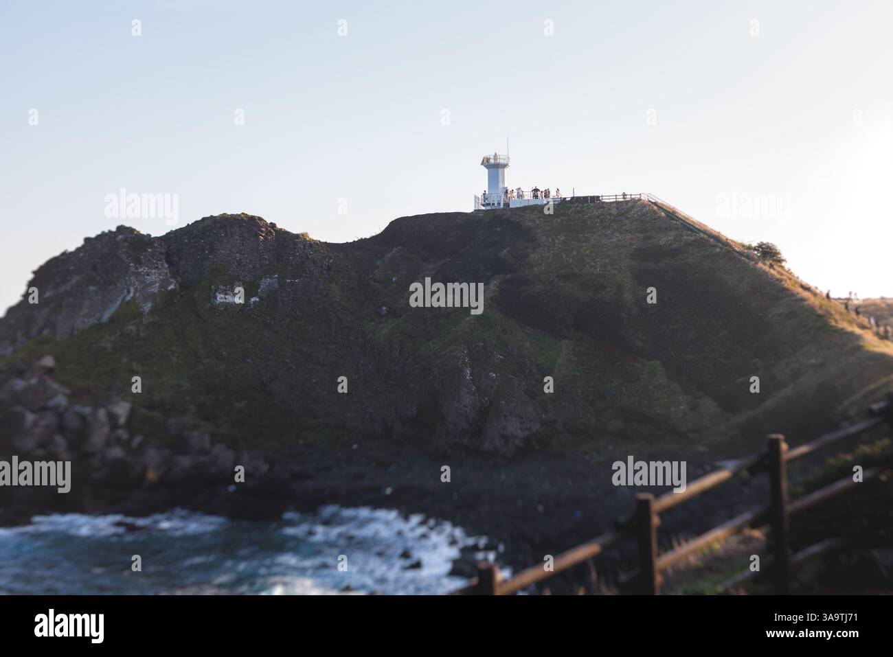 Jeju-do, Seopjikoji cape landscape with lighthouse and sea, east coast ...