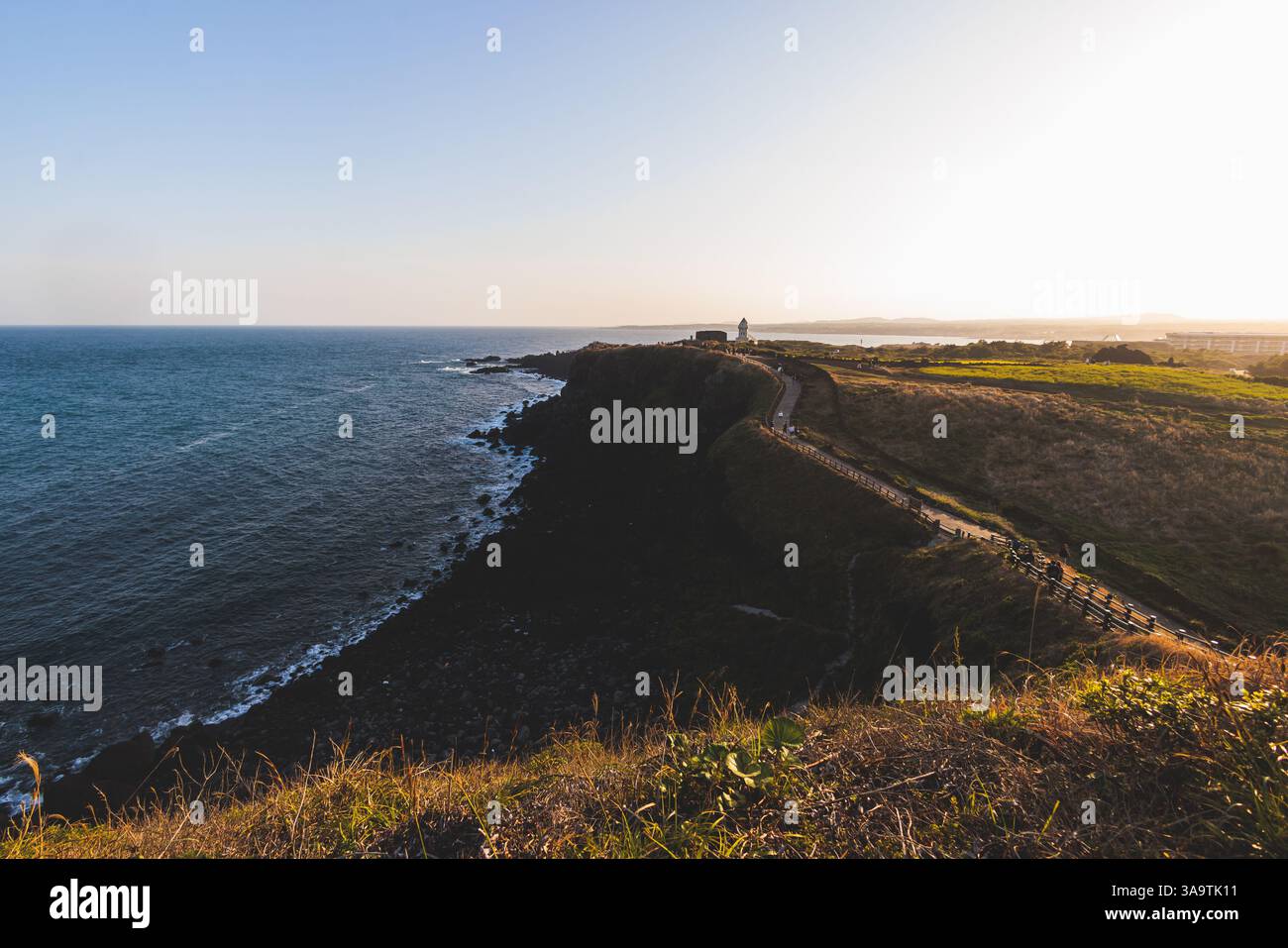 Jeju-do, Seopjikoji cape landscape with lighthouse and sea, east coast ...
