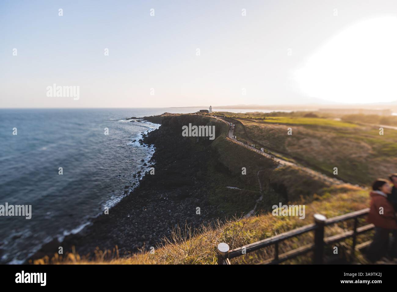 Jeju-do, Seopjikoji cape landscape with lighthouse and sea, east coast ...