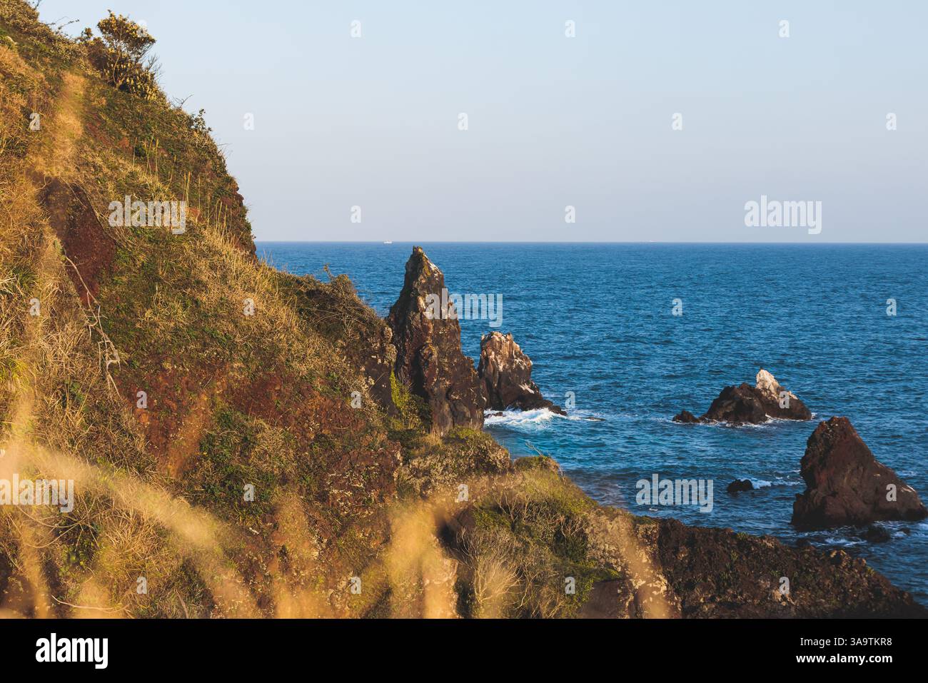 Jeju-do, Seopjikoji cape landscape with lighthouse and sea, east coast ...