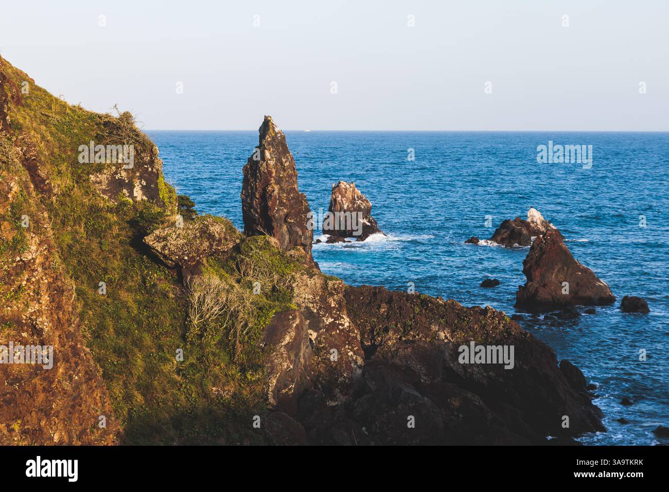 Jeju-do, Seopjikoji cape landscape with lighthouse and sea, east coast ...