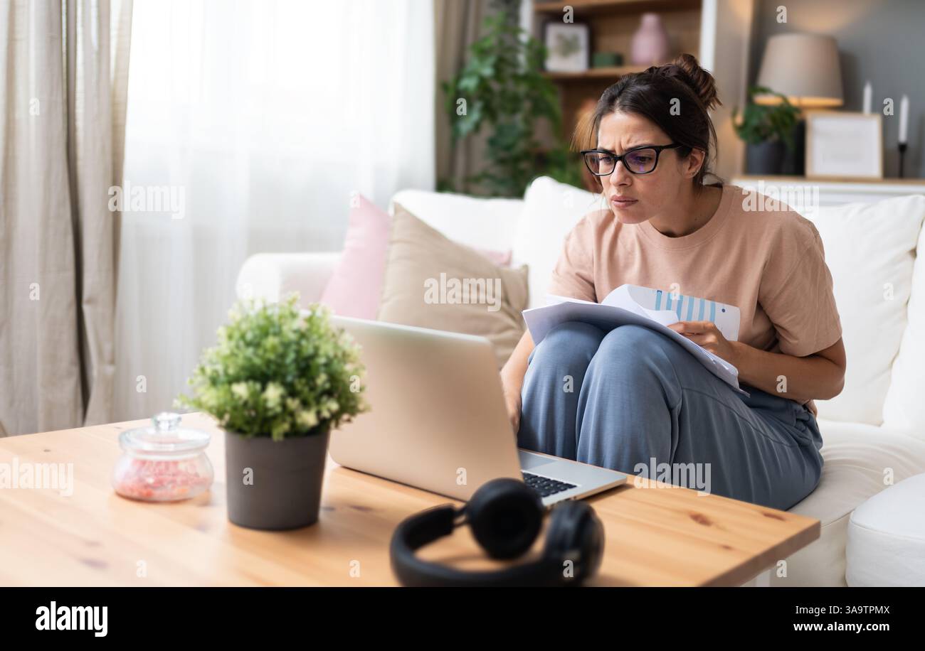 Young educated teacher woman teaching school kids online on laptop computer and video call. E ...