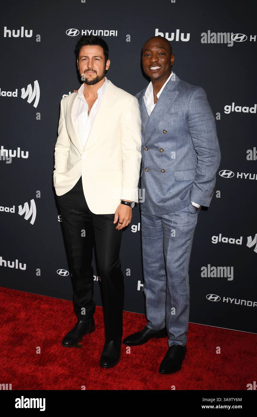 BEVERLY HILLS, CALIFORNIA - MARCH 27: Tyler Hynes and B.J. Britt attend ...