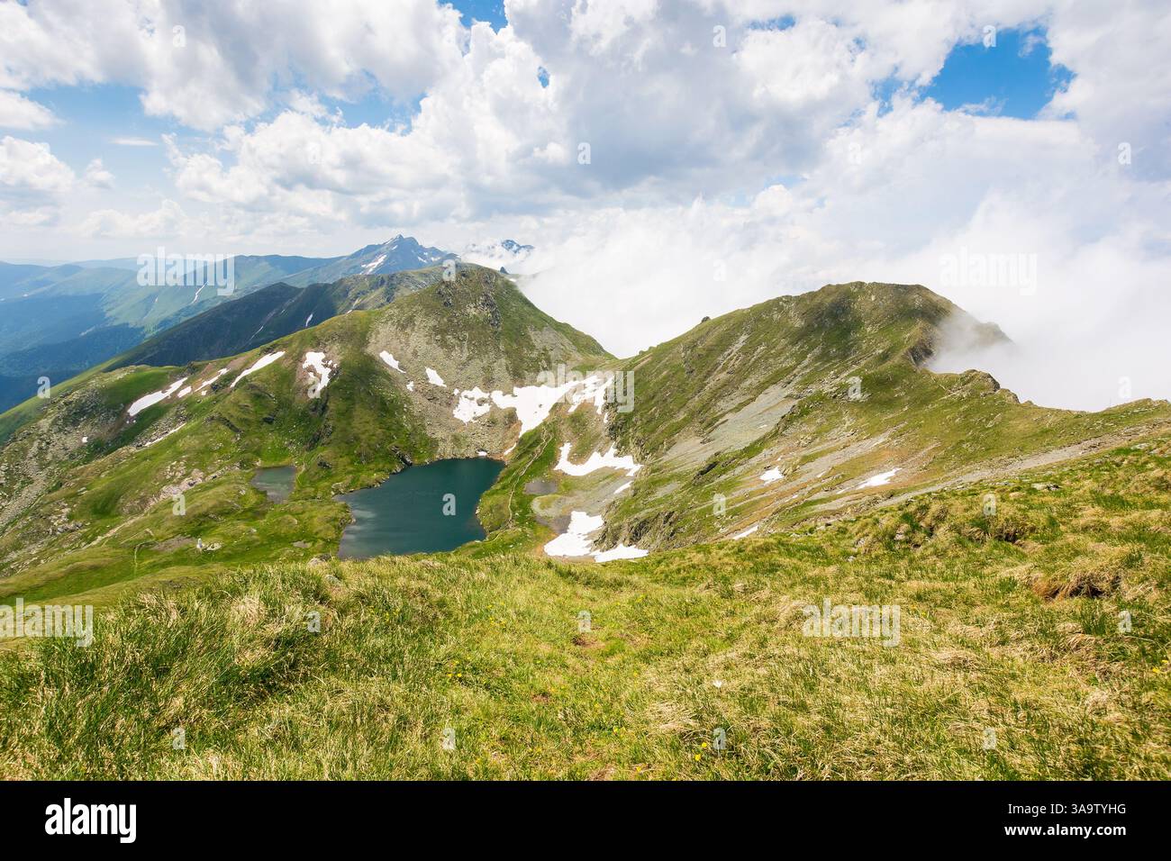 alpine lake capra in mountains of romania. rippled water. picturesque ...