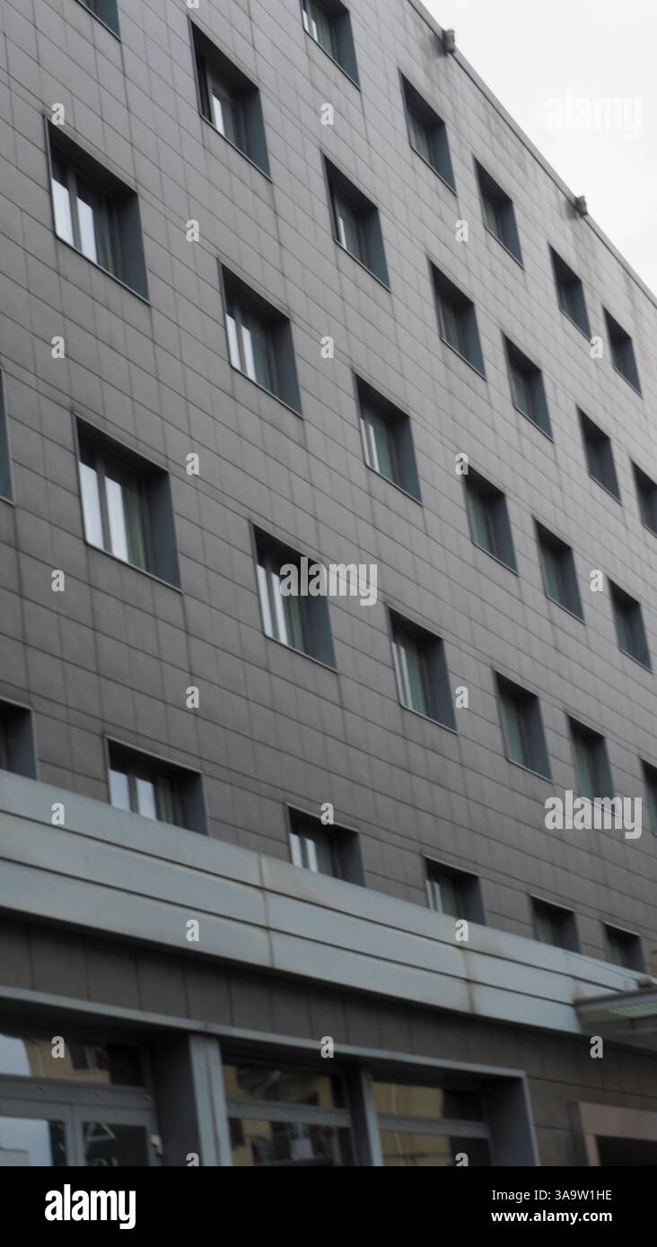 Bologna, Italy February 7th 2025 Gray tiled facade of a modern building ...