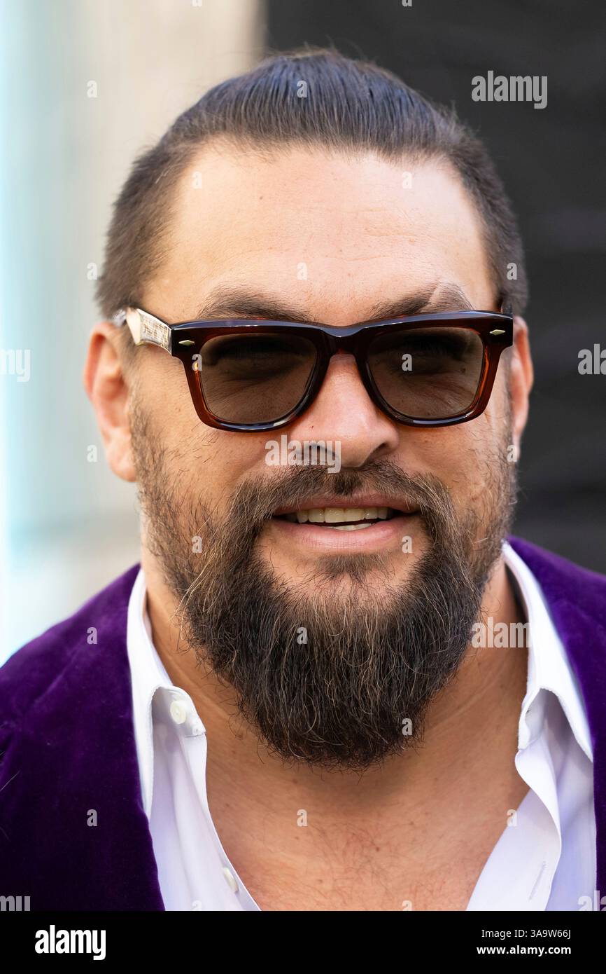 Jason Momoa pose for photographers upon arrival at the World premiere of A Minecraft Movie on ...