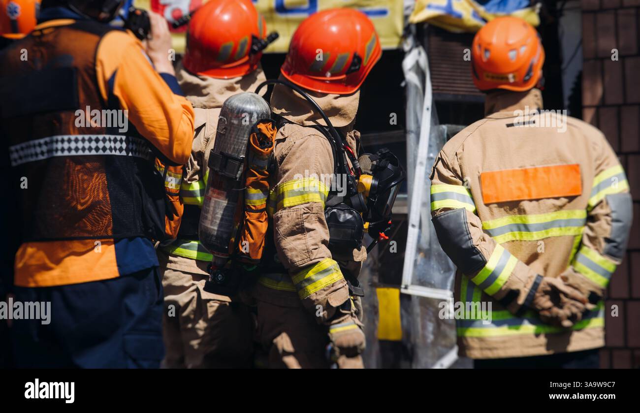 Group of South Korean fire men during fire fighting operation in the ...