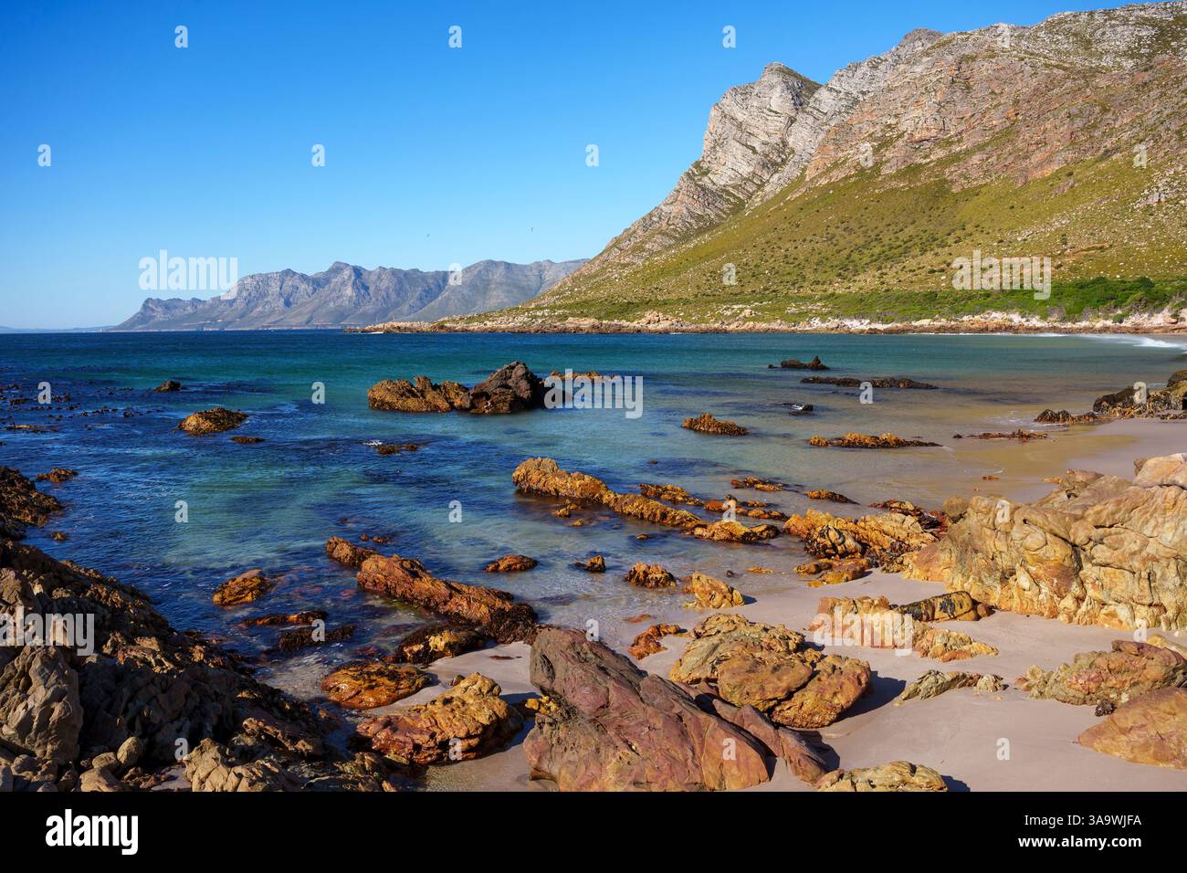 View of the gorgeous Rooi Els beach with the Kogelberg Mountains and ...