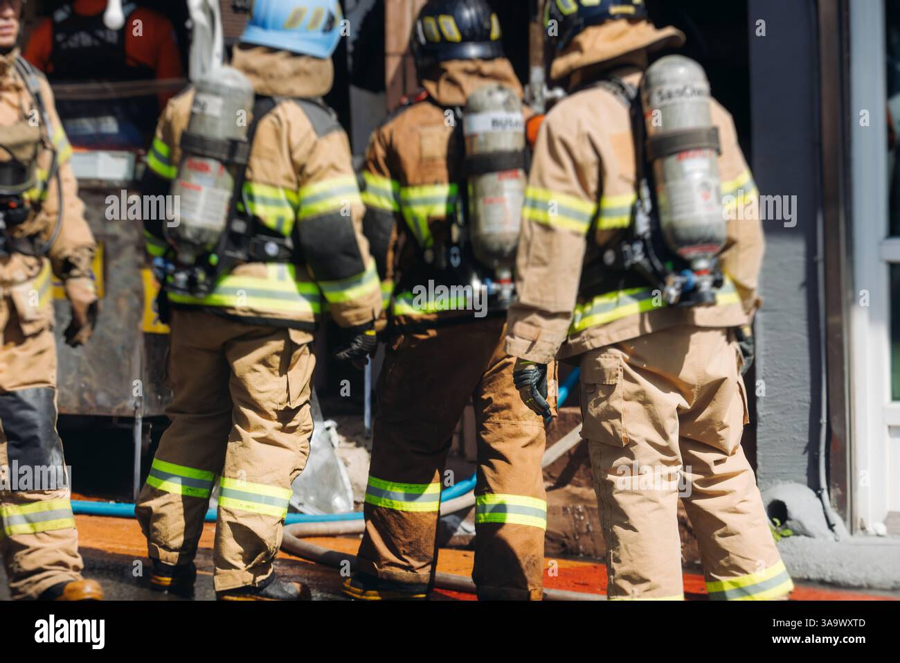Group of South Korean fire men during fire fighting operation in the ...