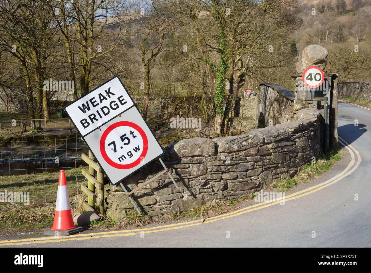 A traffic sign warns of a weak bridge with a weight limit of 7.5 tonnes ...
