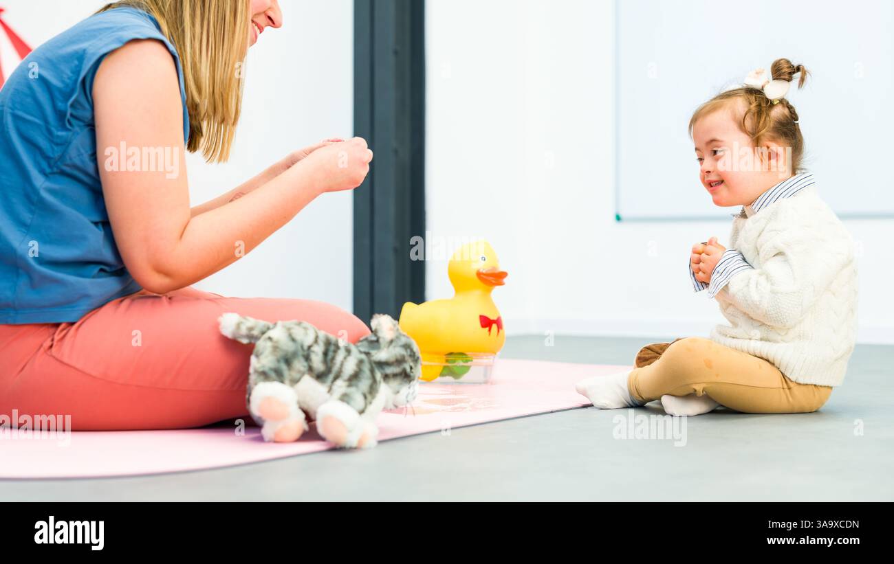 Nonverbal child with Down syndrome learning baby sign language with the ...