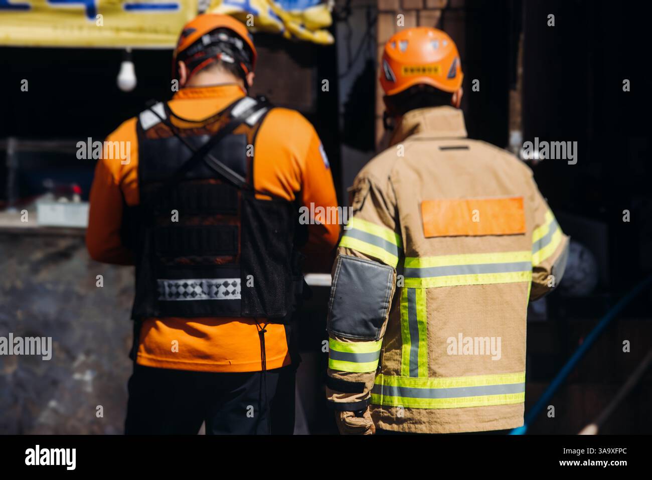 Group of South Korean fire men during fire fighting operation in the ...