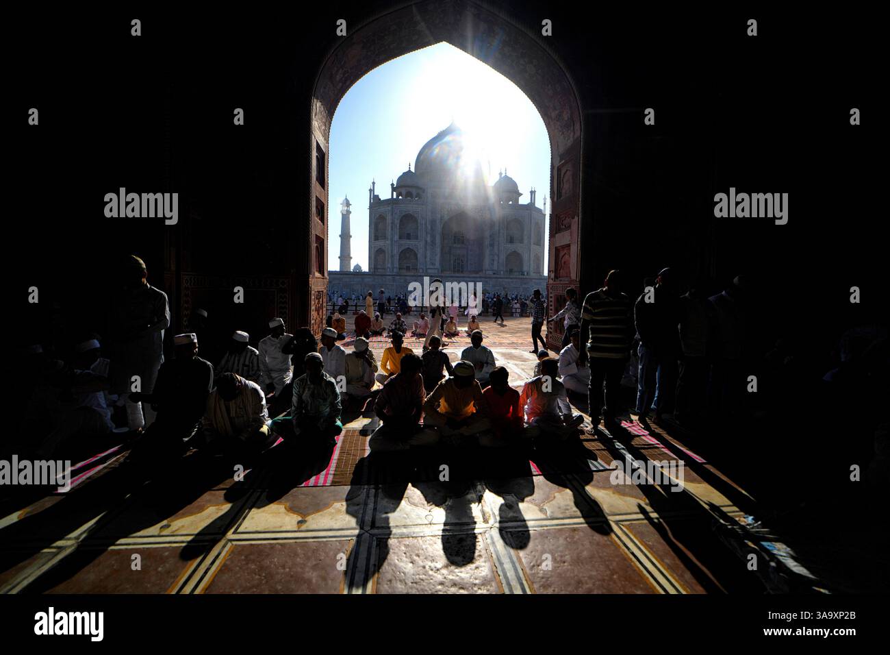 Muslim devotees seen getting ready for Eid al-Fitr morning prayers at the Taj Mahal. Muslims ...