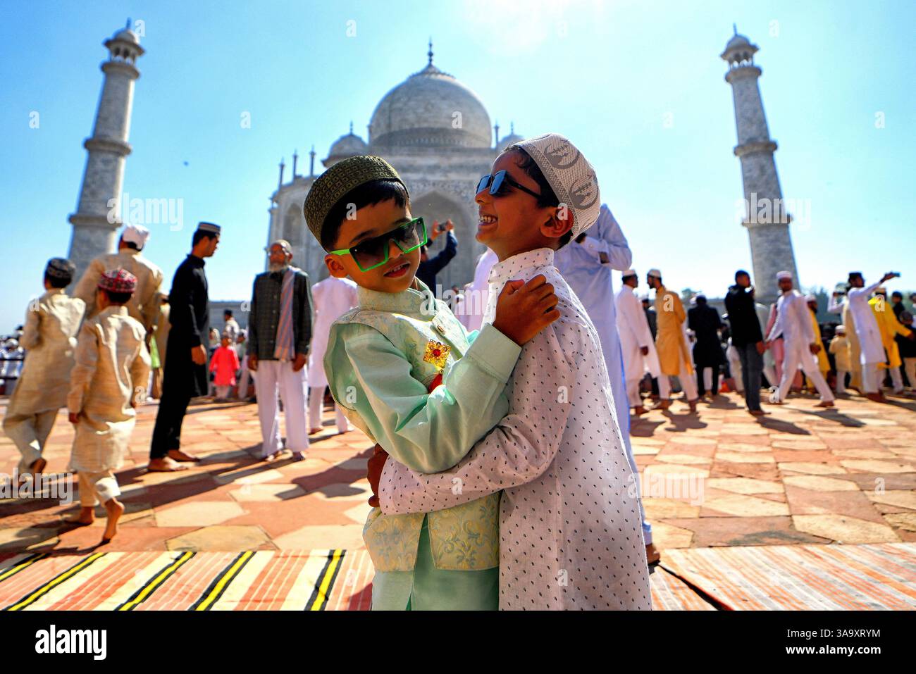 Agra, India. 31st Mar, 2025. Muslim children greet each other after ...