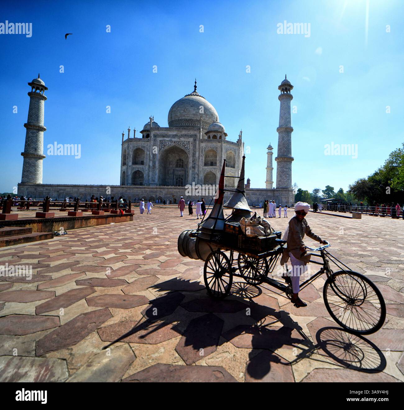 Agra, India. 31st Mar, 2025. An Indian Muslim boy rides a bicycle with ...