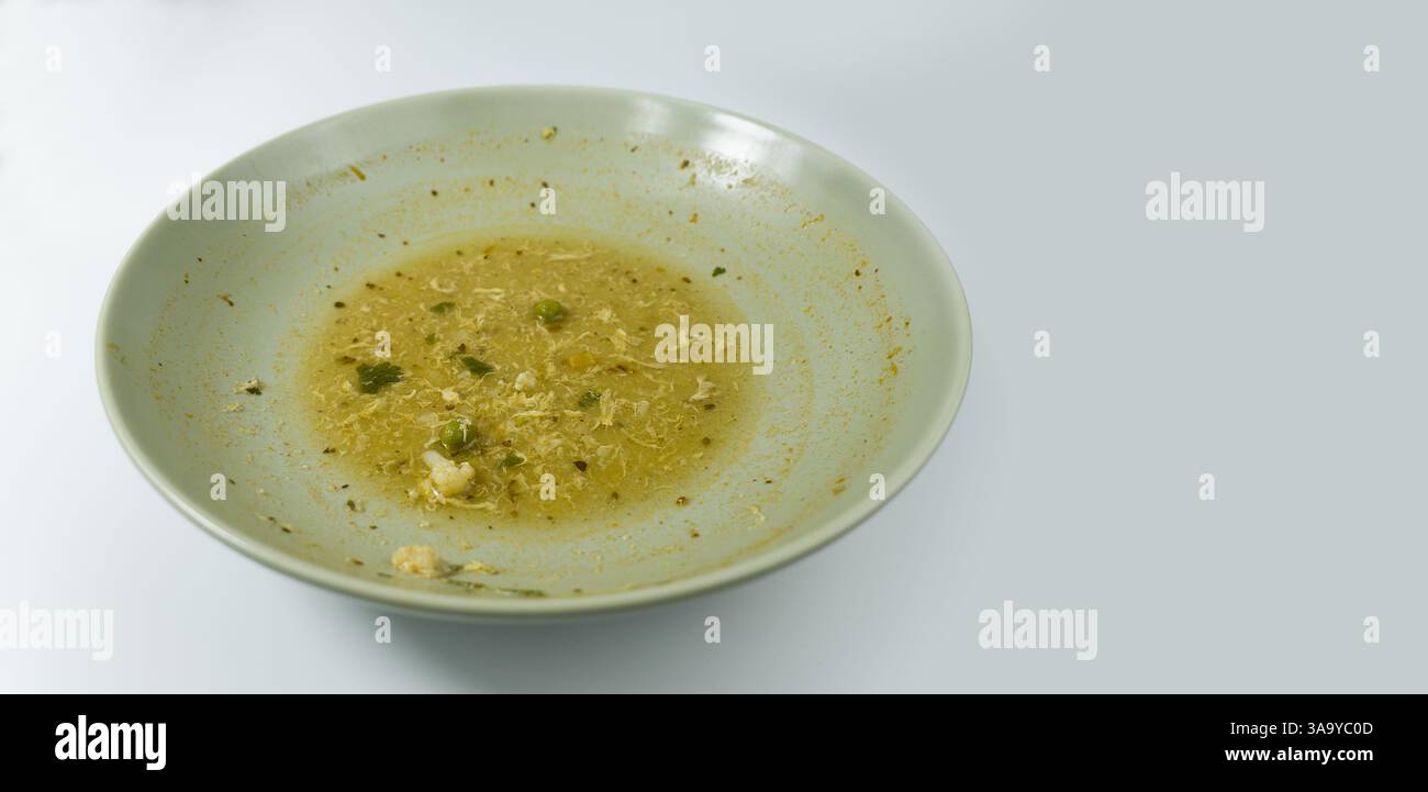 Dirty food waste in a plate on white background Stock Photo - Alamy