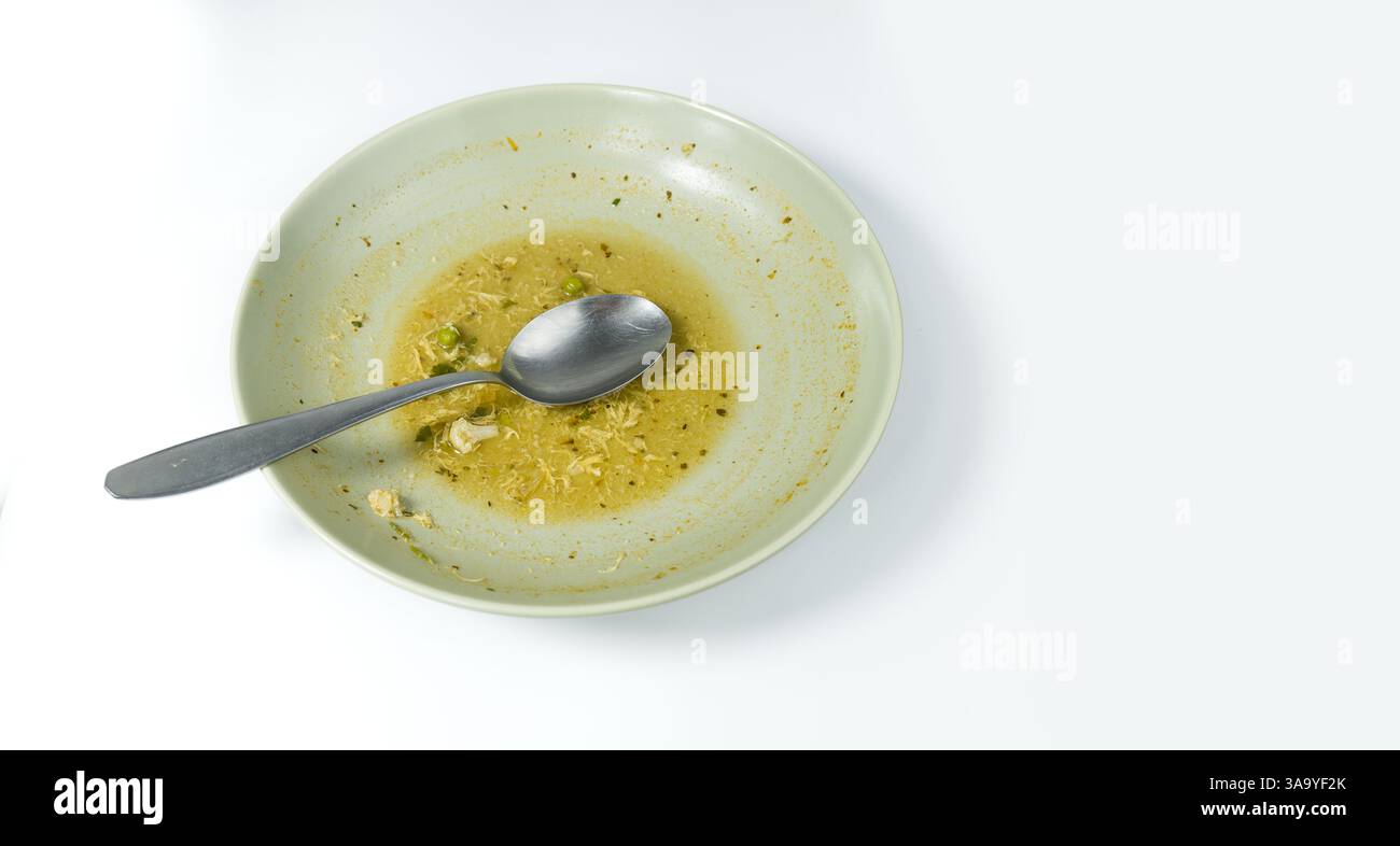 Dirty food waste in a plate on white background Stock Photo - Alamy