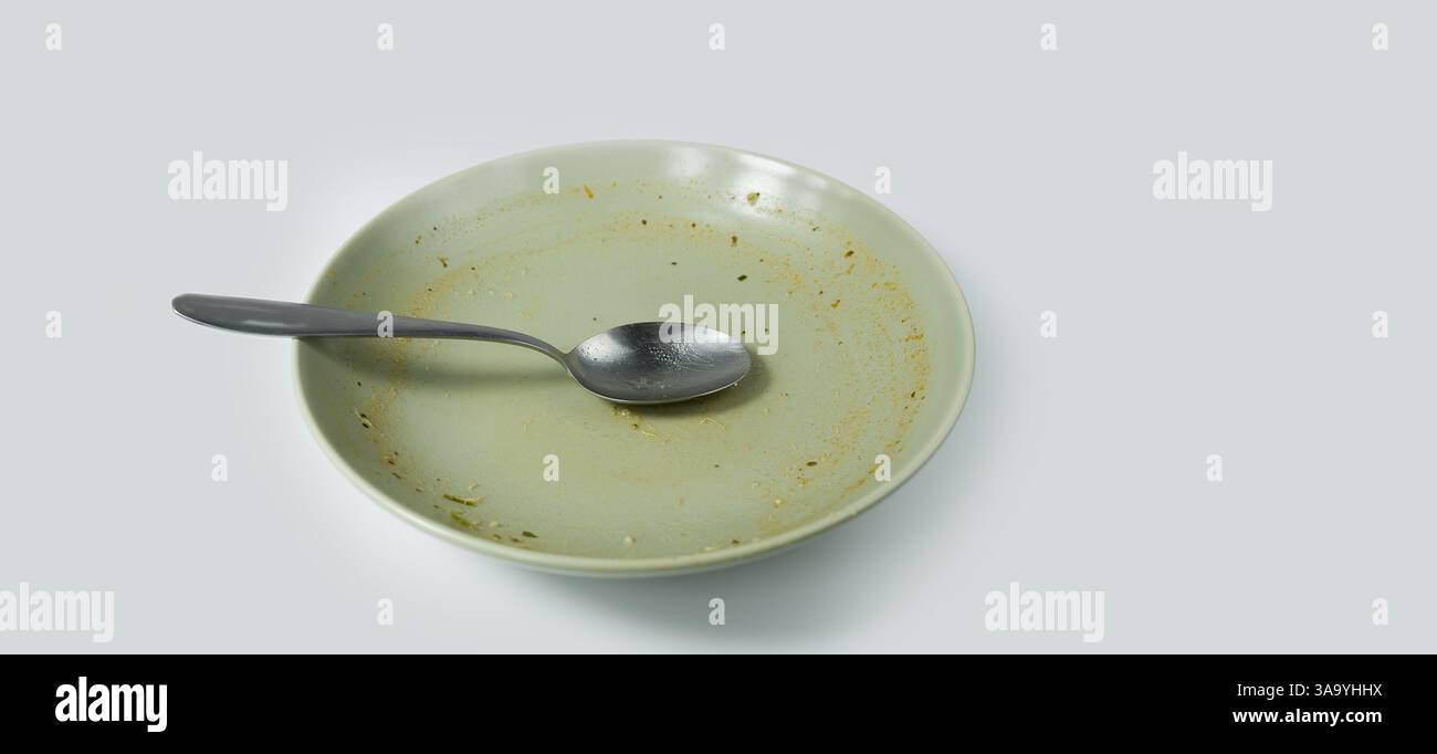 Dirty food waste in a plate on white background Stock Photo - Alamy