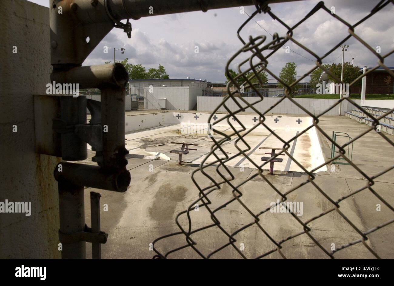 Highlands High School swimming pool is empty. The bottom is peeling and ...