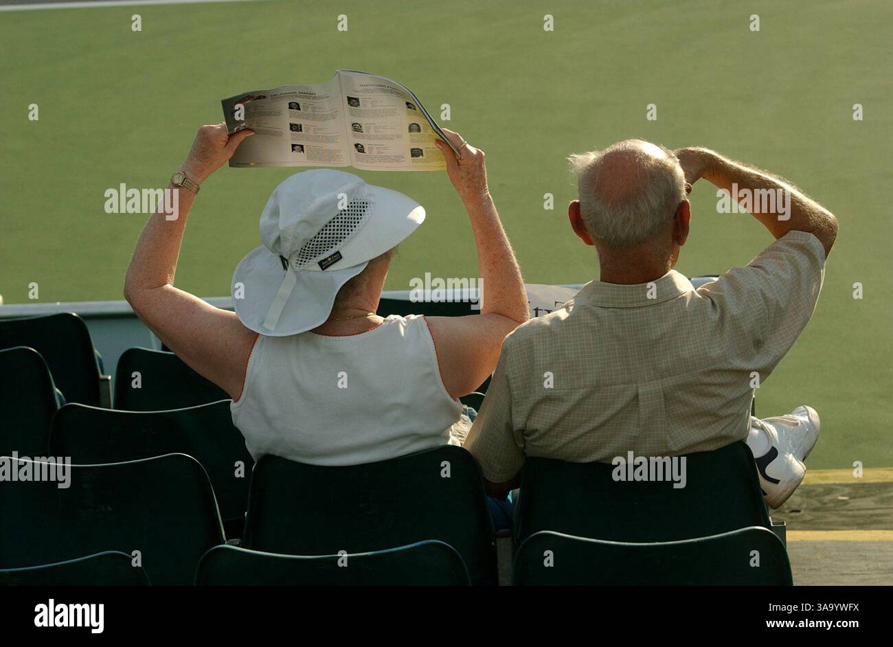 Ruby and Joe Kelley (cq) of Redding, CA shield their eyes from the sun ...