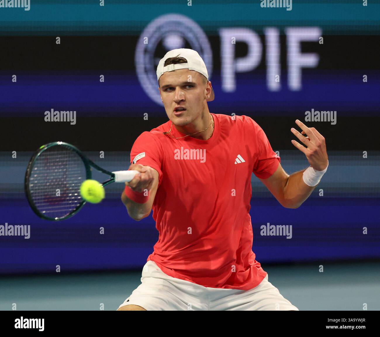 MIAMI GARDENS, MARCH 30: Jakub Mensik of (CZE) returns a shot to Novak Djokovic of (SRB) during ...