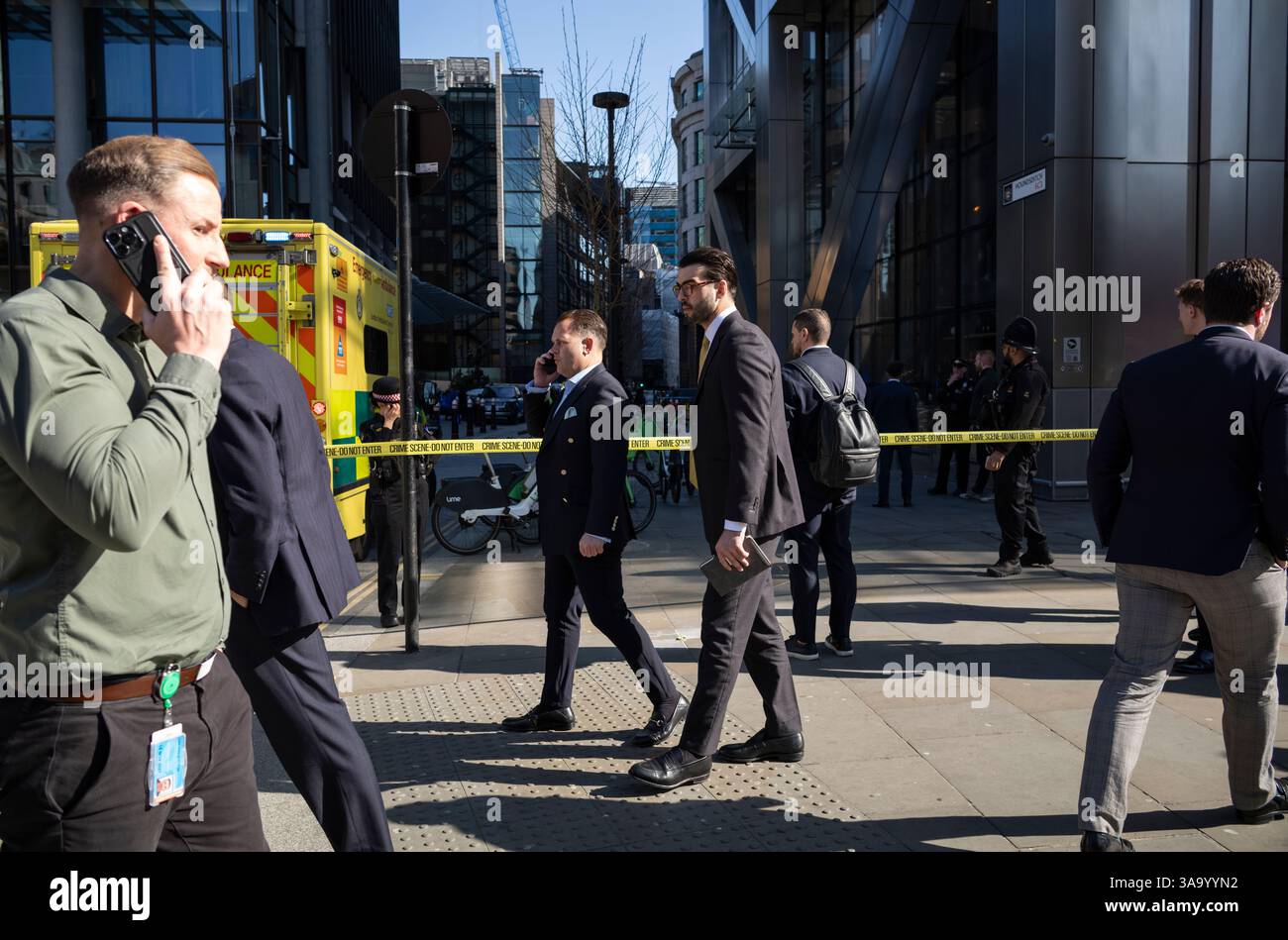 City workers gather on Bishopsgate after a person has died after falling from Heron Tower near ...