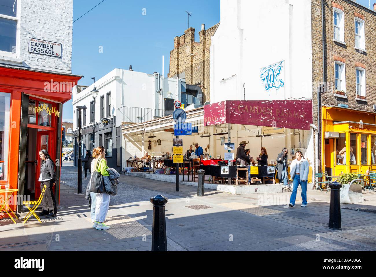 Shoppers browsing the antique shops and stalls in Camden Passage at The ...