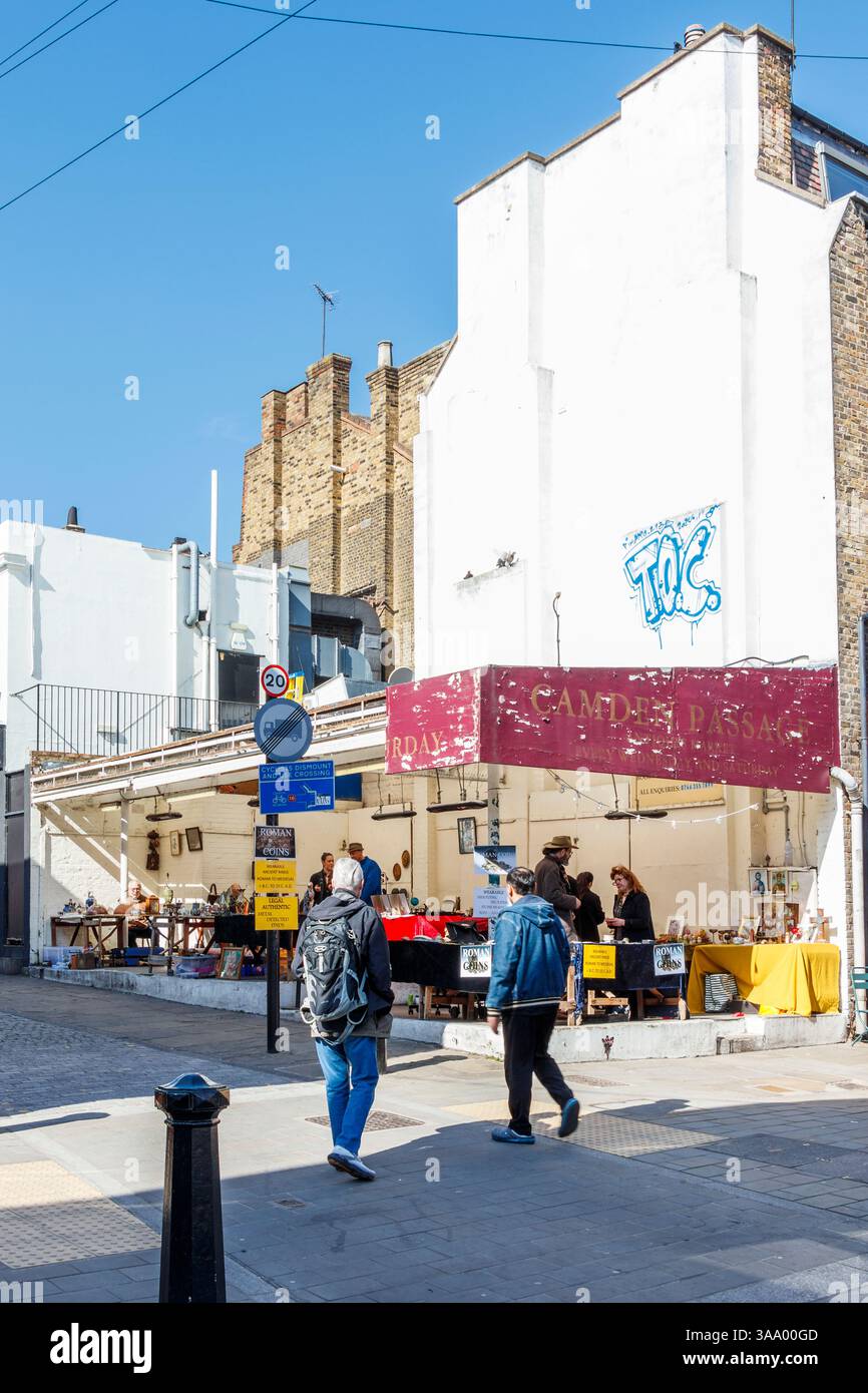 Shoppers browsing the antique shops and stalls in Camden Passage at The ...