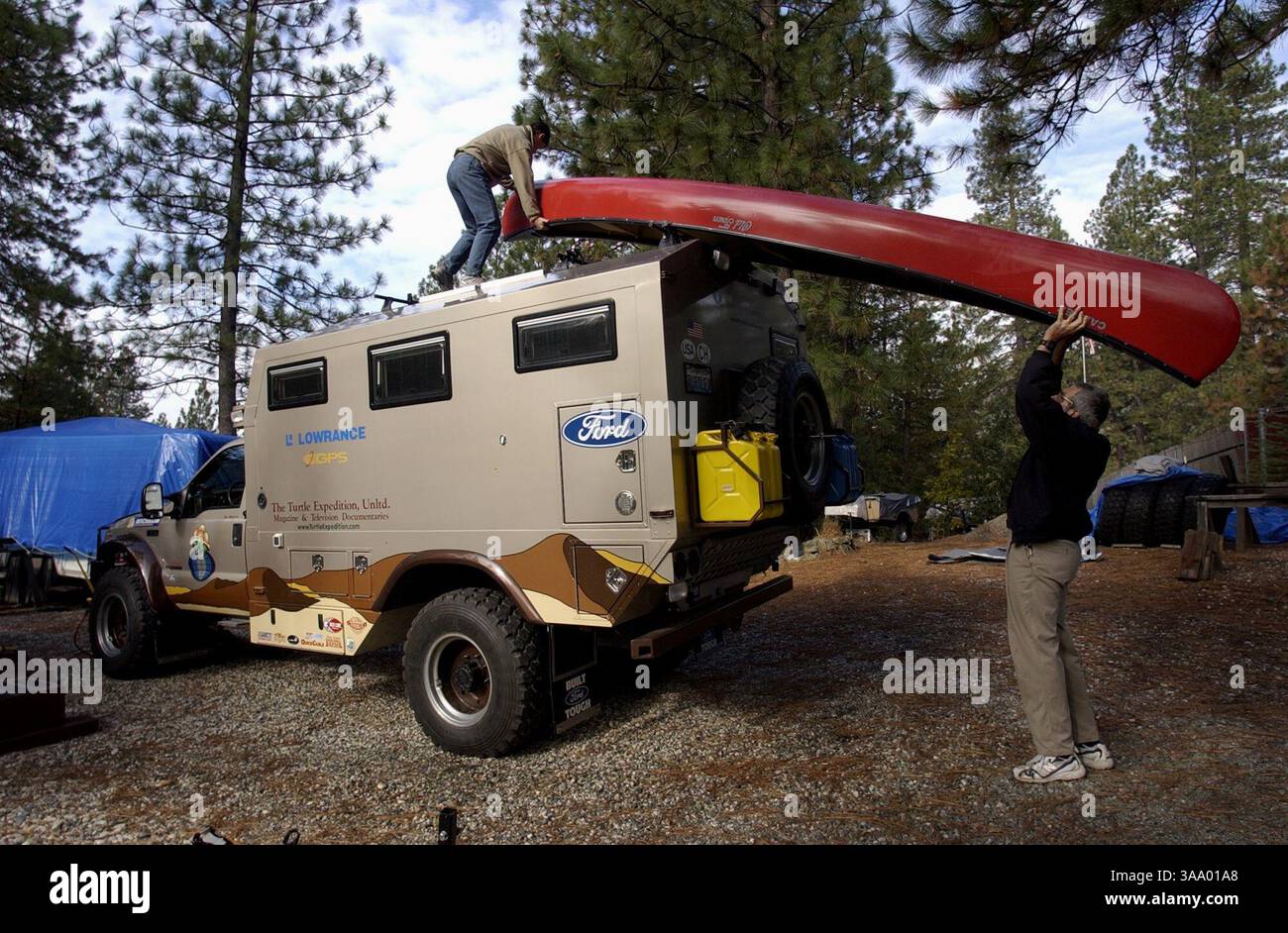 Turtle Expedition Gary Wescott, on the ground, helps his wife Monika ...